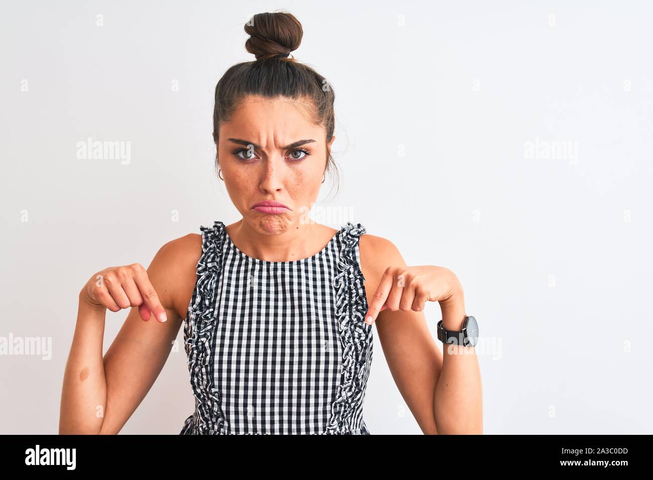Beautiful Woman With Bun Wearing Casual Dresss Standing Over Isolated