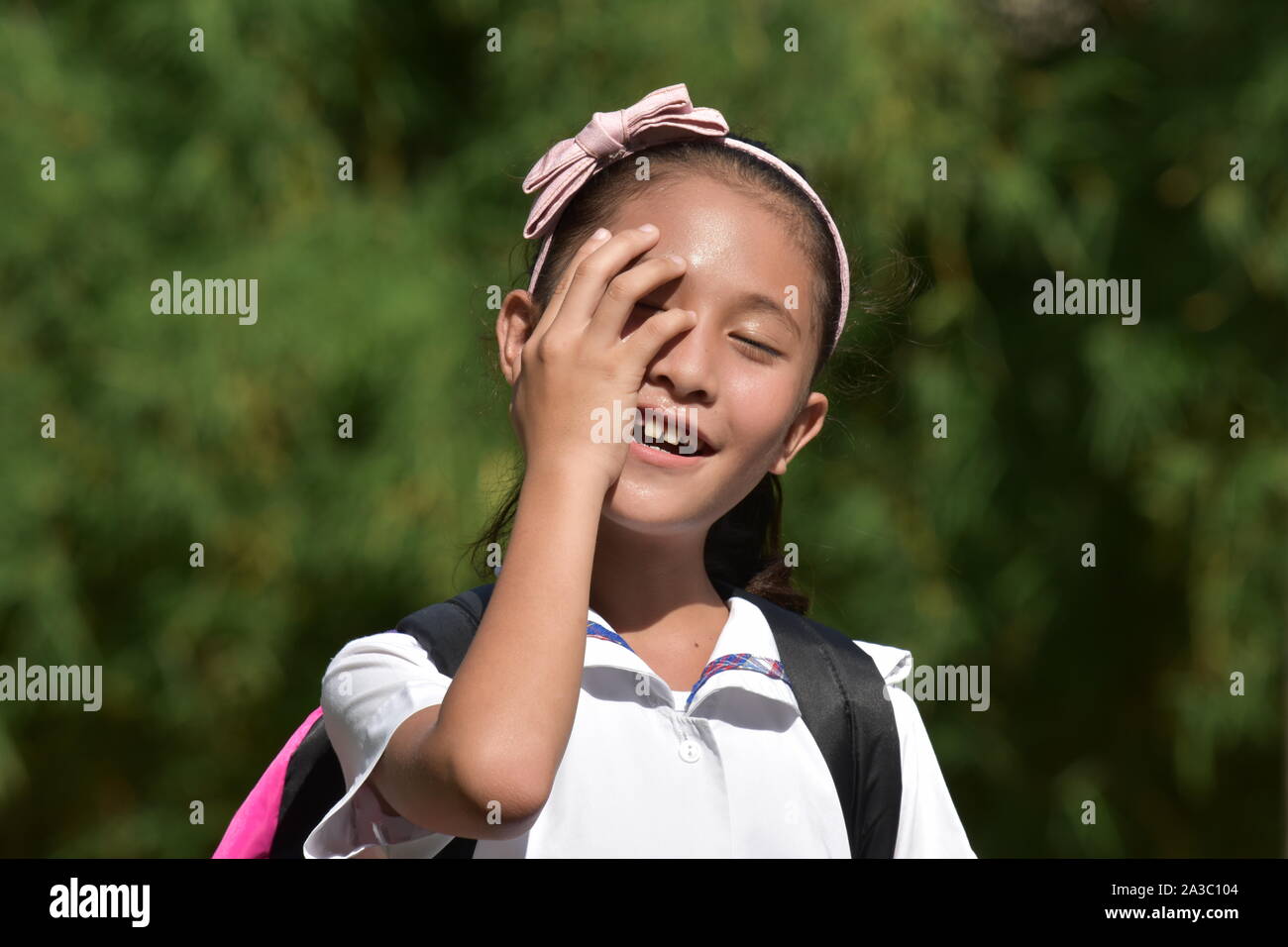 A Forgetful Girl Student With Books Stock Photo - Alamy