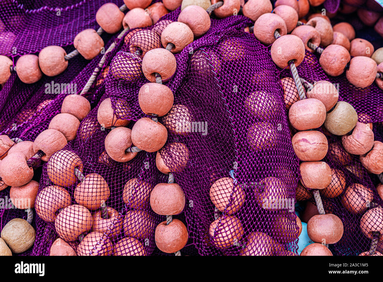 Lots of red fishing nets in a port of Athens, Greece Stock Photo - Alamy