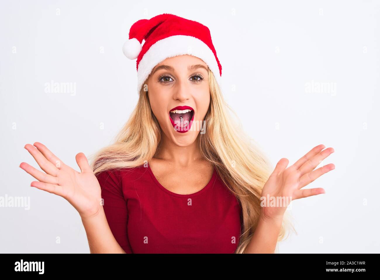 Young Beautiful Woman Wearing Christmas Santa Hat Over Isolated White