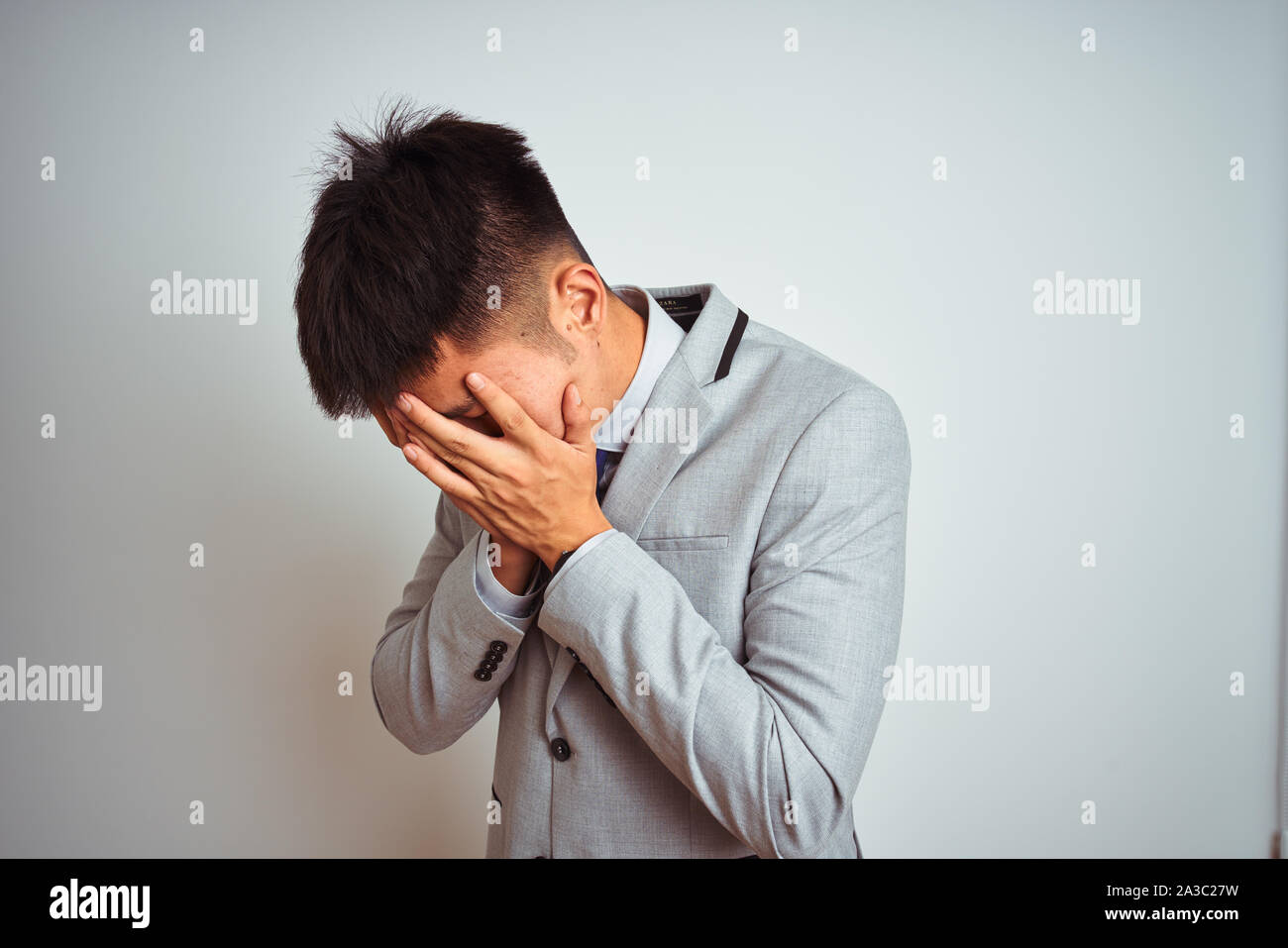 Asian chinese businessman wearing suit and tie standing over isolated ...
