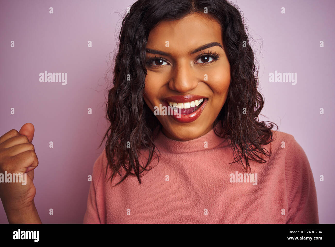 Young beautiful transsexual transgender woman standing over isolated ...