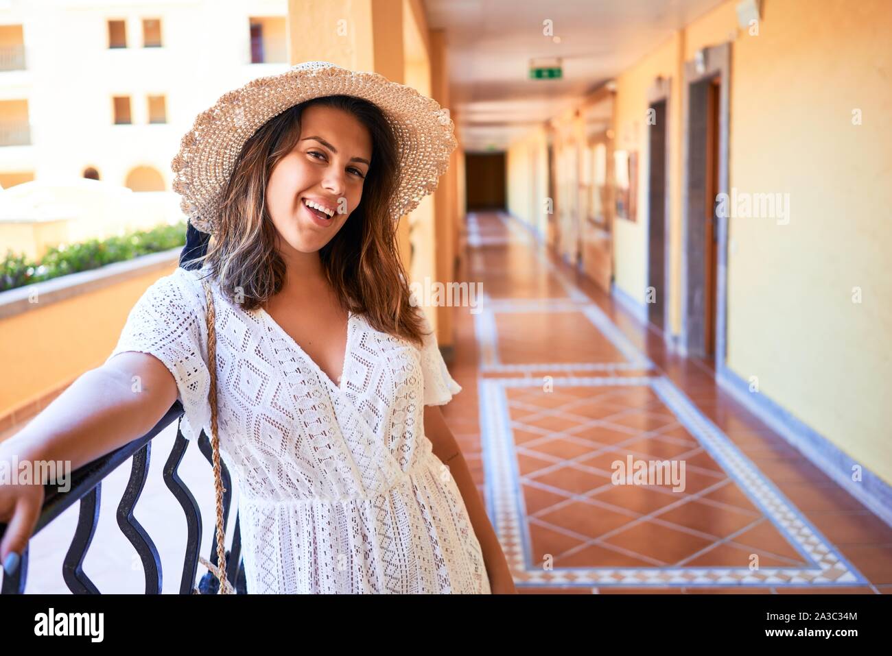 Young beautiful woman smiling happy and positive indoors of hotel ...