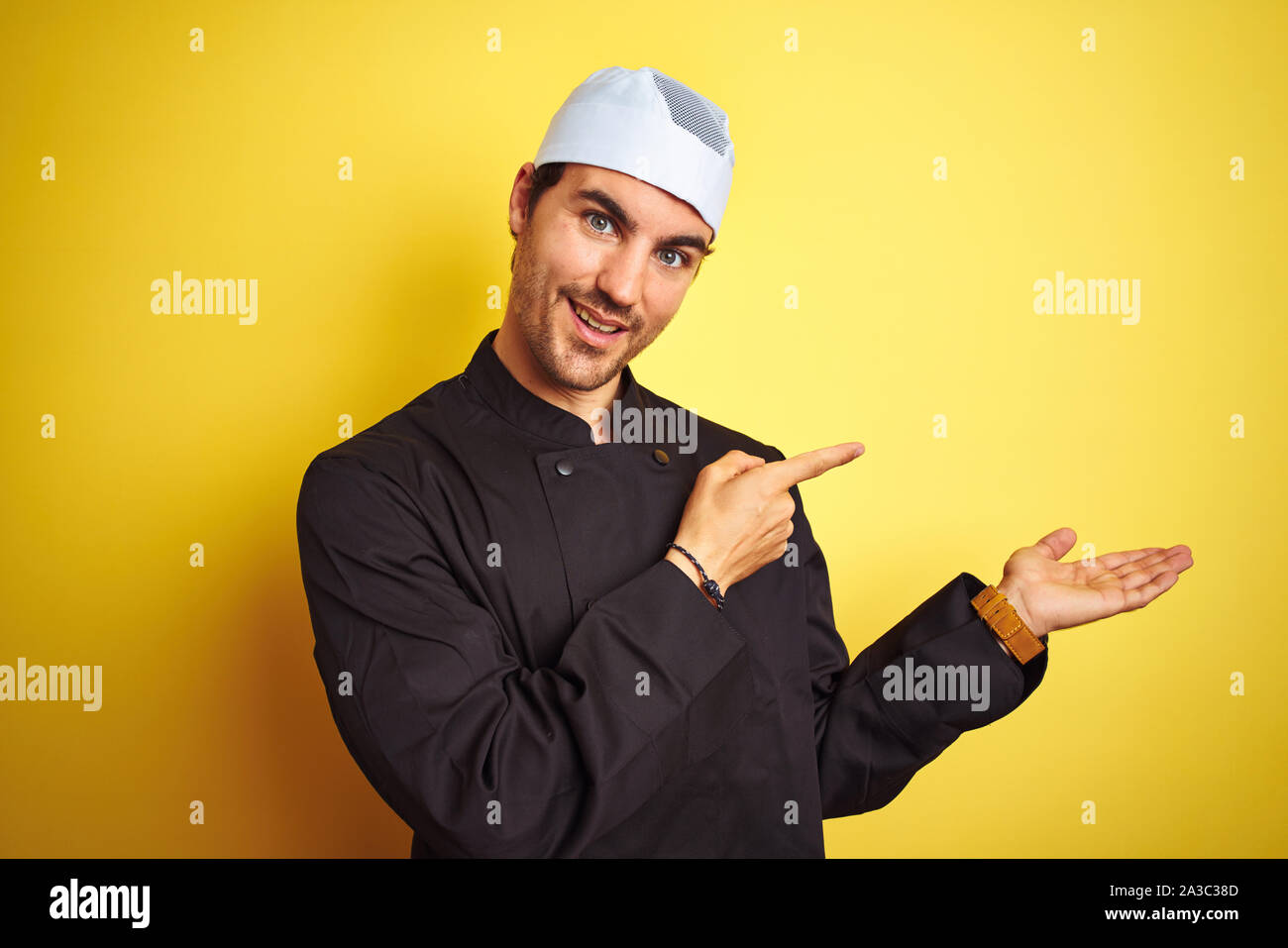 Handsome chef presenting meal hi-res stock photography and images - Alamy