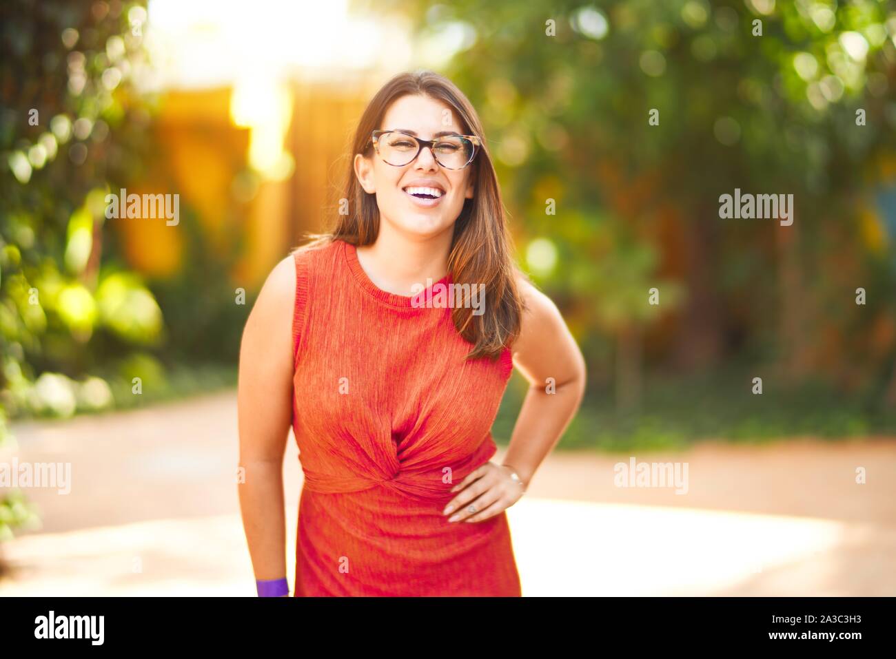 Young beautiful girl smiling happy and confident walking at the town ...