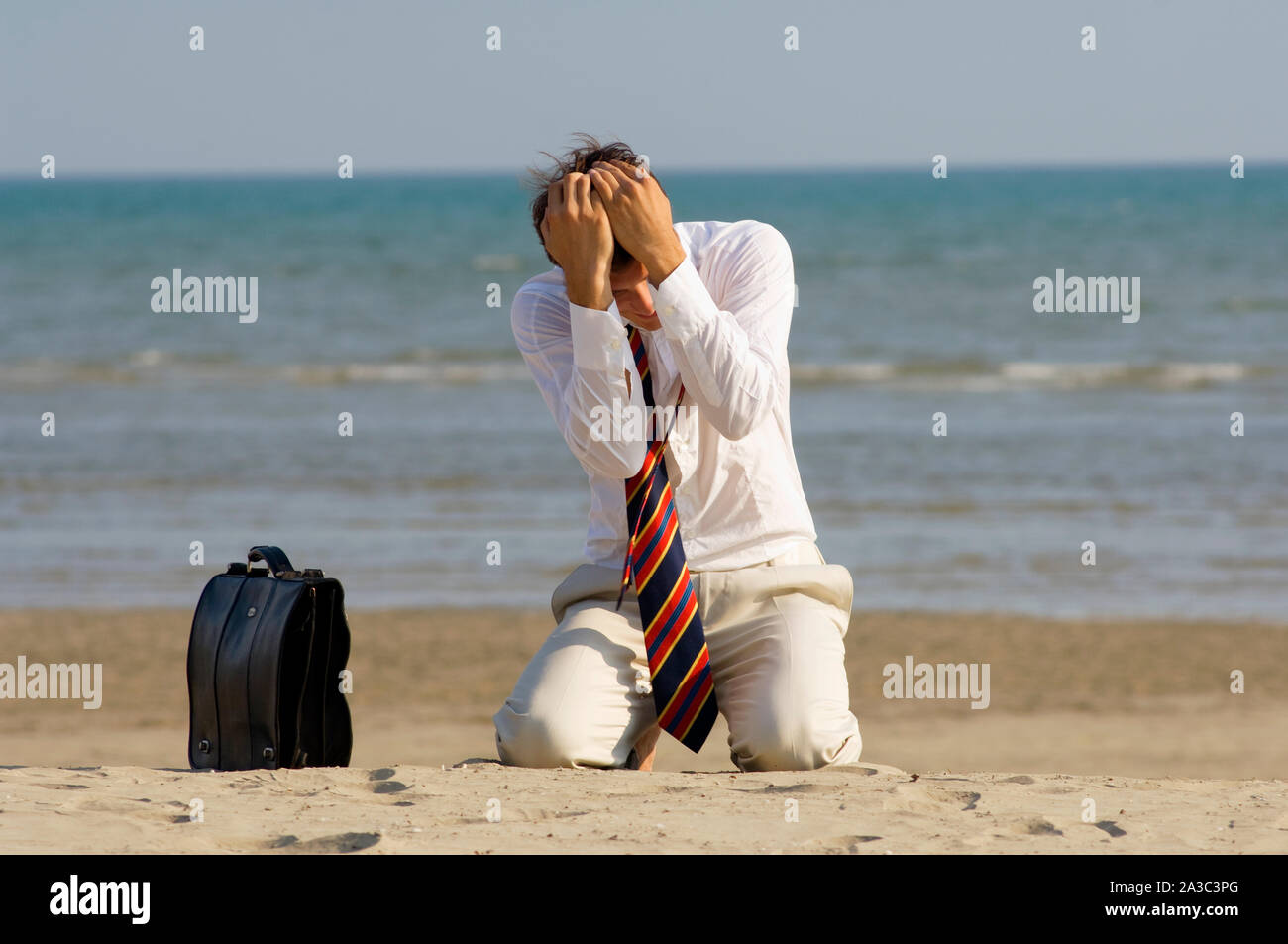 Tie beach hands person hi-res stock photography and images - Alamy