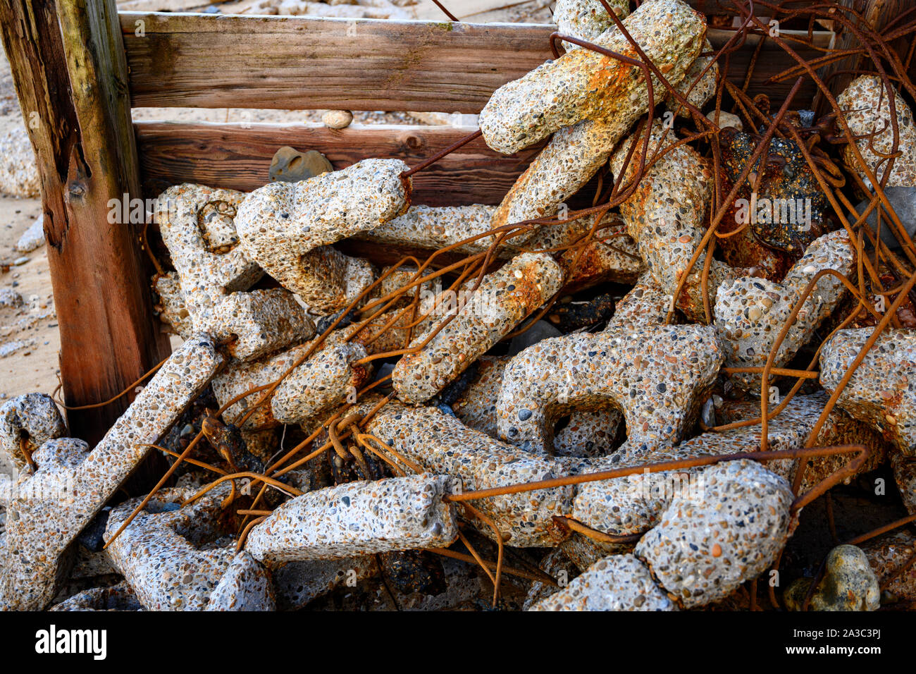 Concrete groynes effected by coastal erosion Stock Photo - Alamy