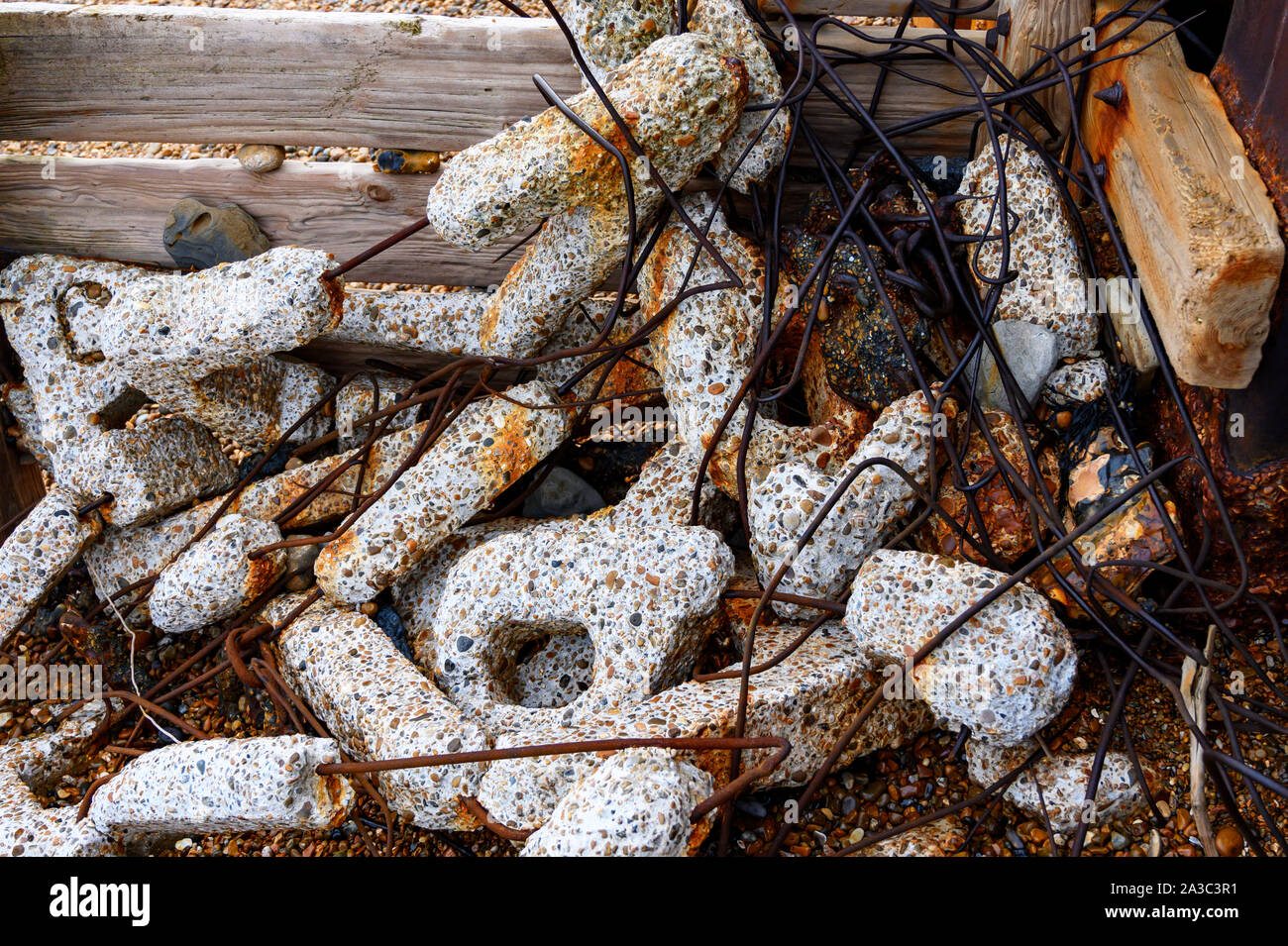 Concrete groynes effected by coastal erosion Stock Photo - Alamy