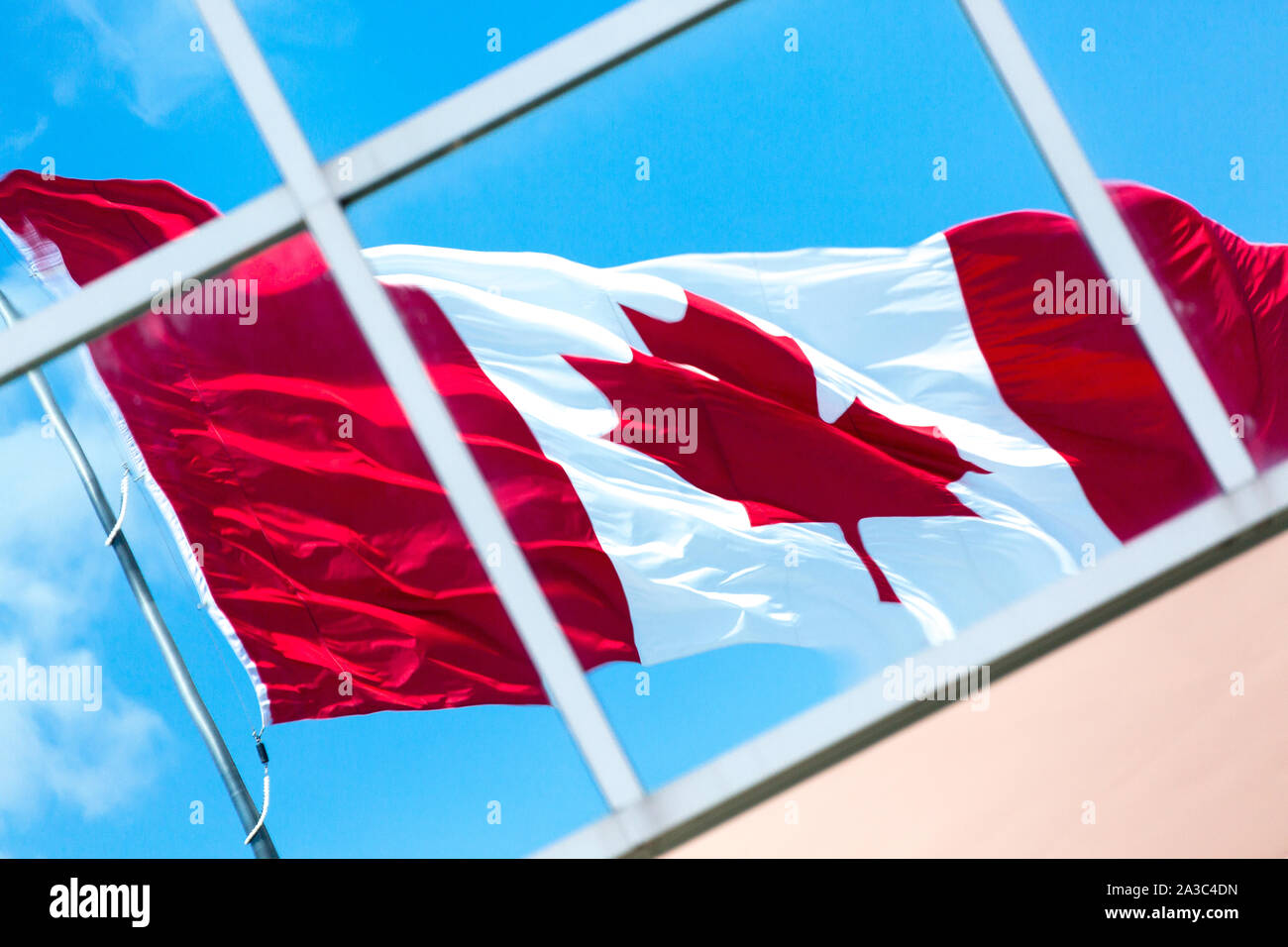 Canadian flag reflected in offices windows at Halifax seafront. Nova ...