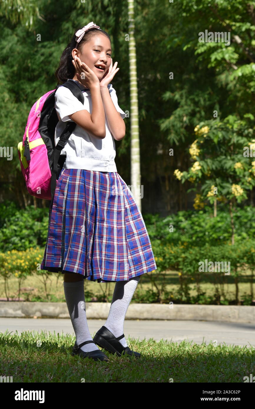 A Surprised Girl Student Wearing Uniform Stock Photo - Alamy