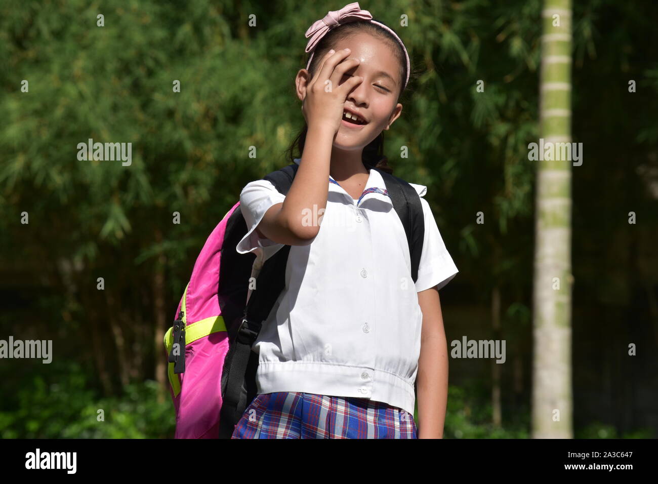 Cute Asian Female Student Memory Problems With Books Stock Photo - Alamy