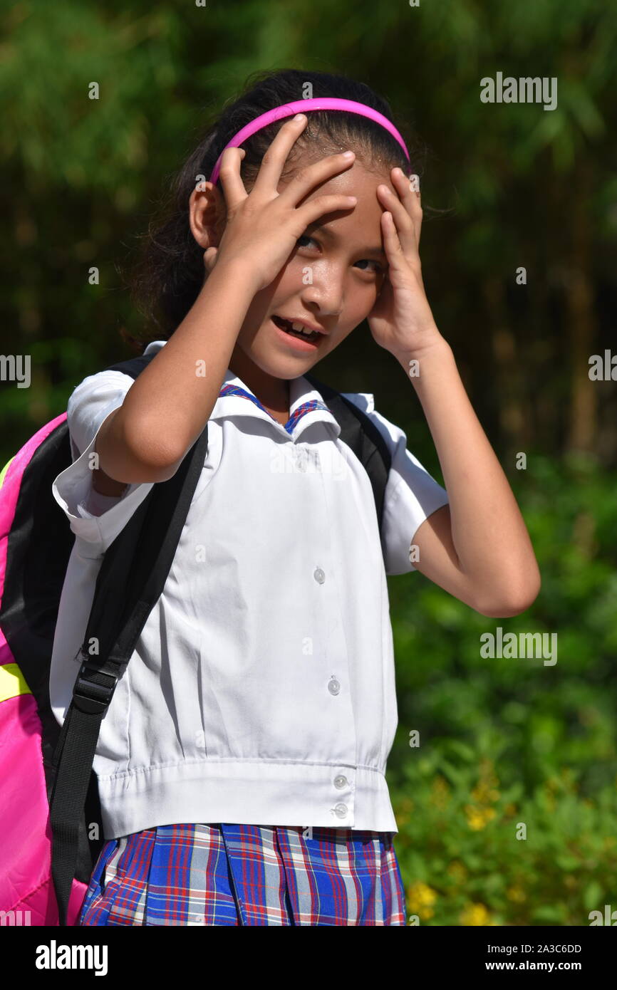 A Stressful Girl Student With Books Stock Photo - Alamy