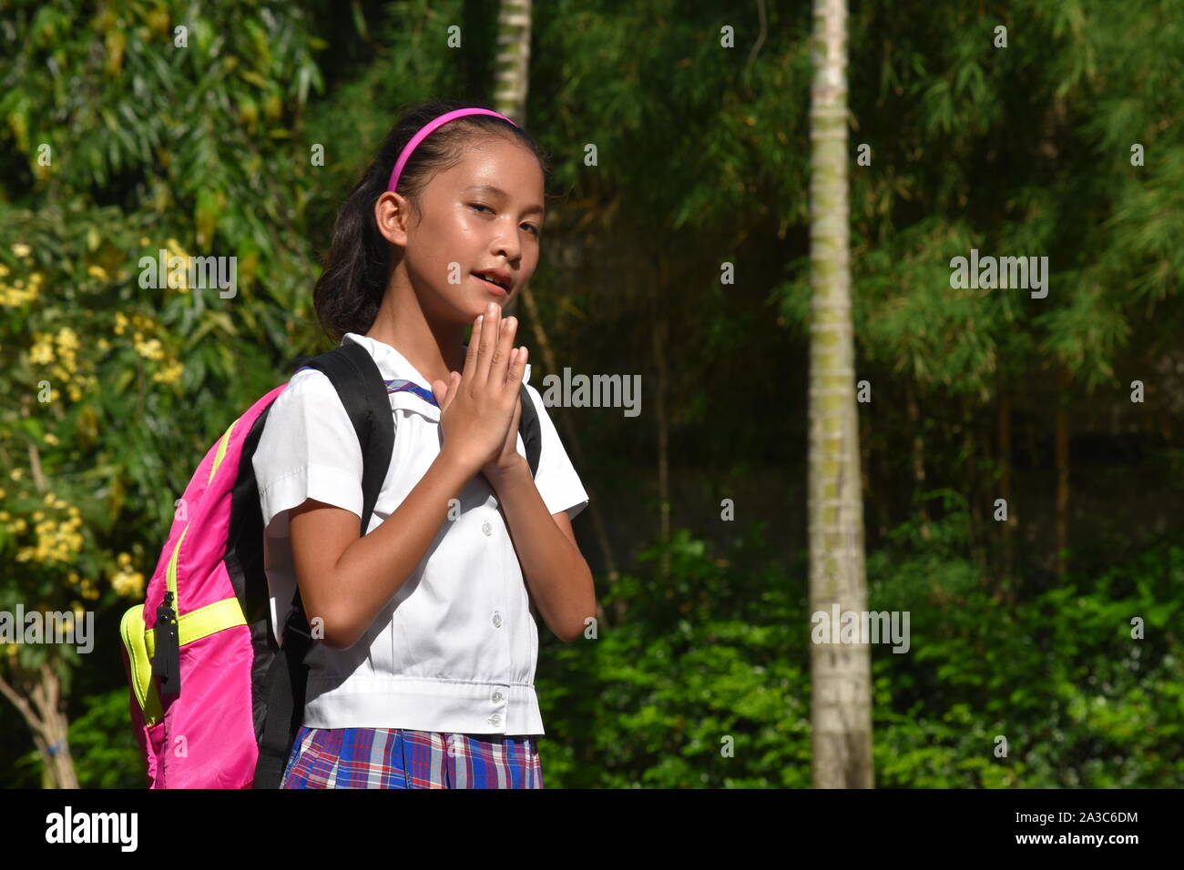 Female Student Praying Wearing School Uniform Stock Photo - Alamy