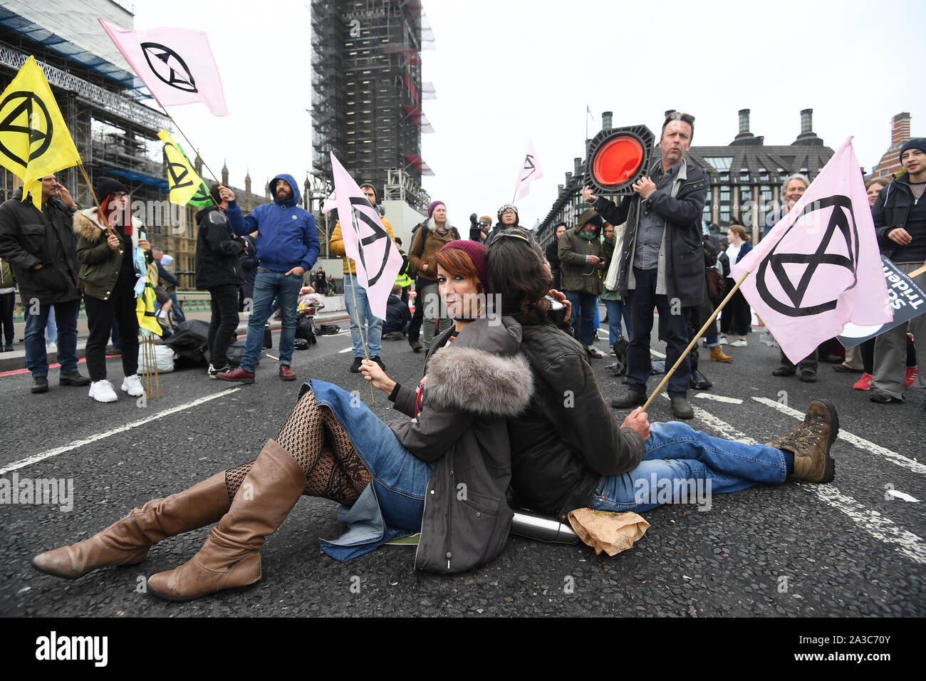 A pair of protesters chained together at the neck on Westminster Bridge ...
