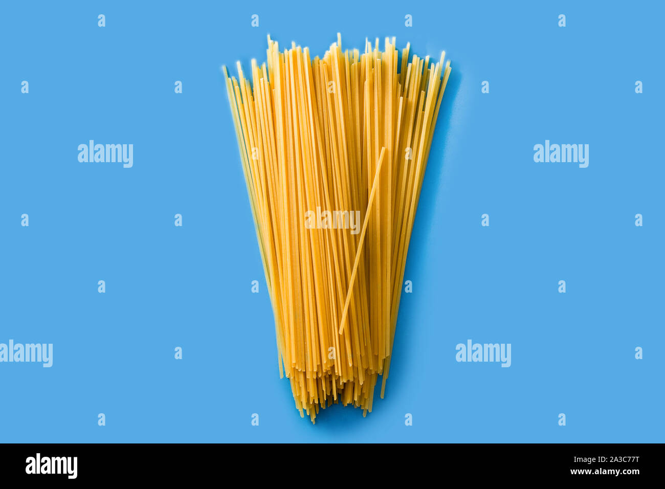 Uncooked pasta on blue hi-res stock photography and images - Alamy