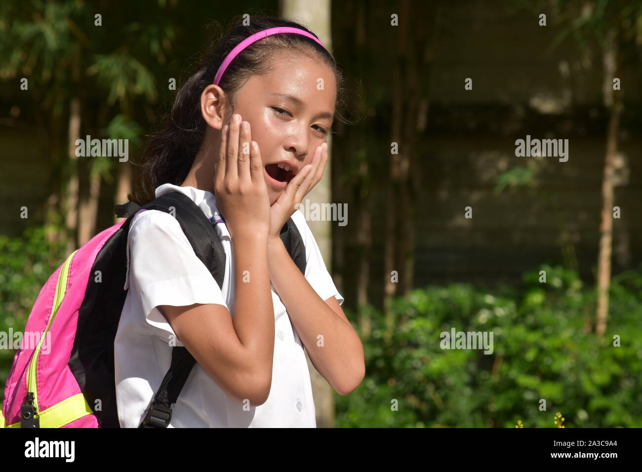 Startled Beautiful Filipina Person With Books Stock Photo - Alamy