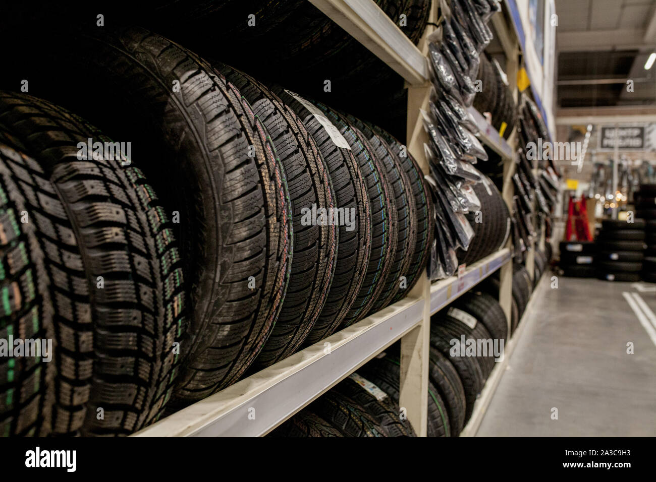 Car tires and wheels at warehouse in tire store Stock Photo - Alamy