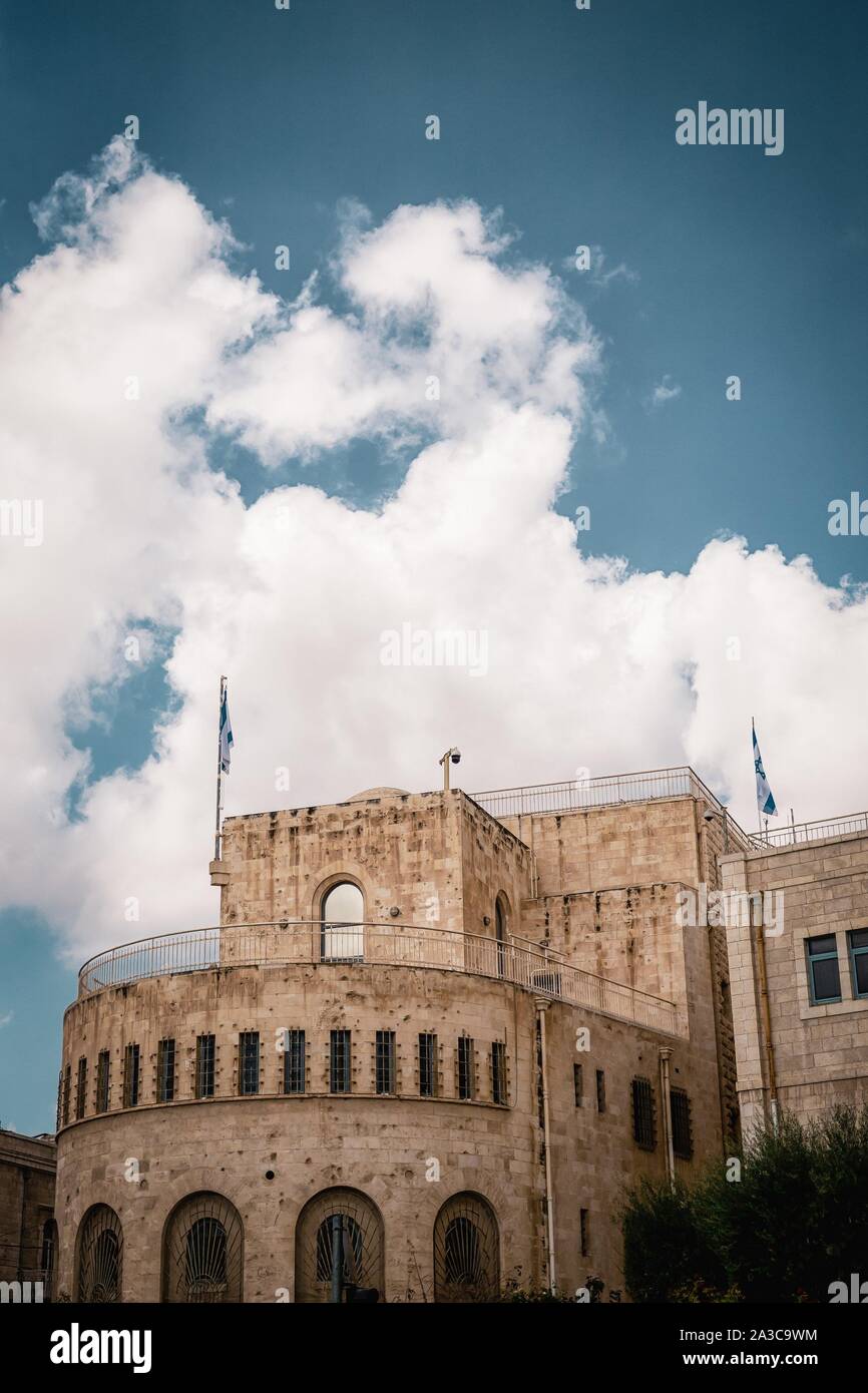 Jerusalem Historical City Hall Building, flags of Israel and cloudy sky ...