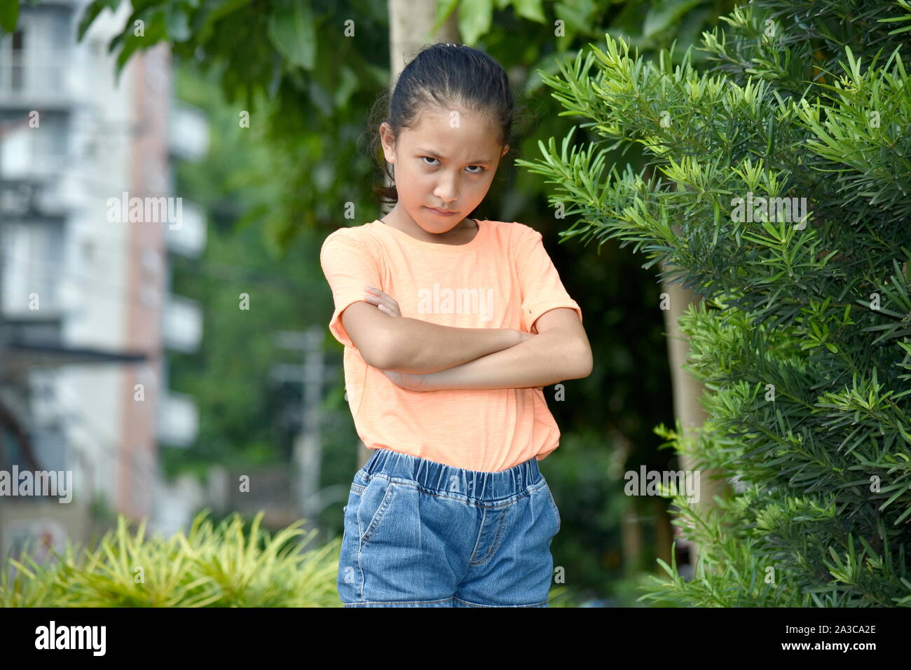 A Stubborn Youthful Asian Girl Stock Photo - Alamy