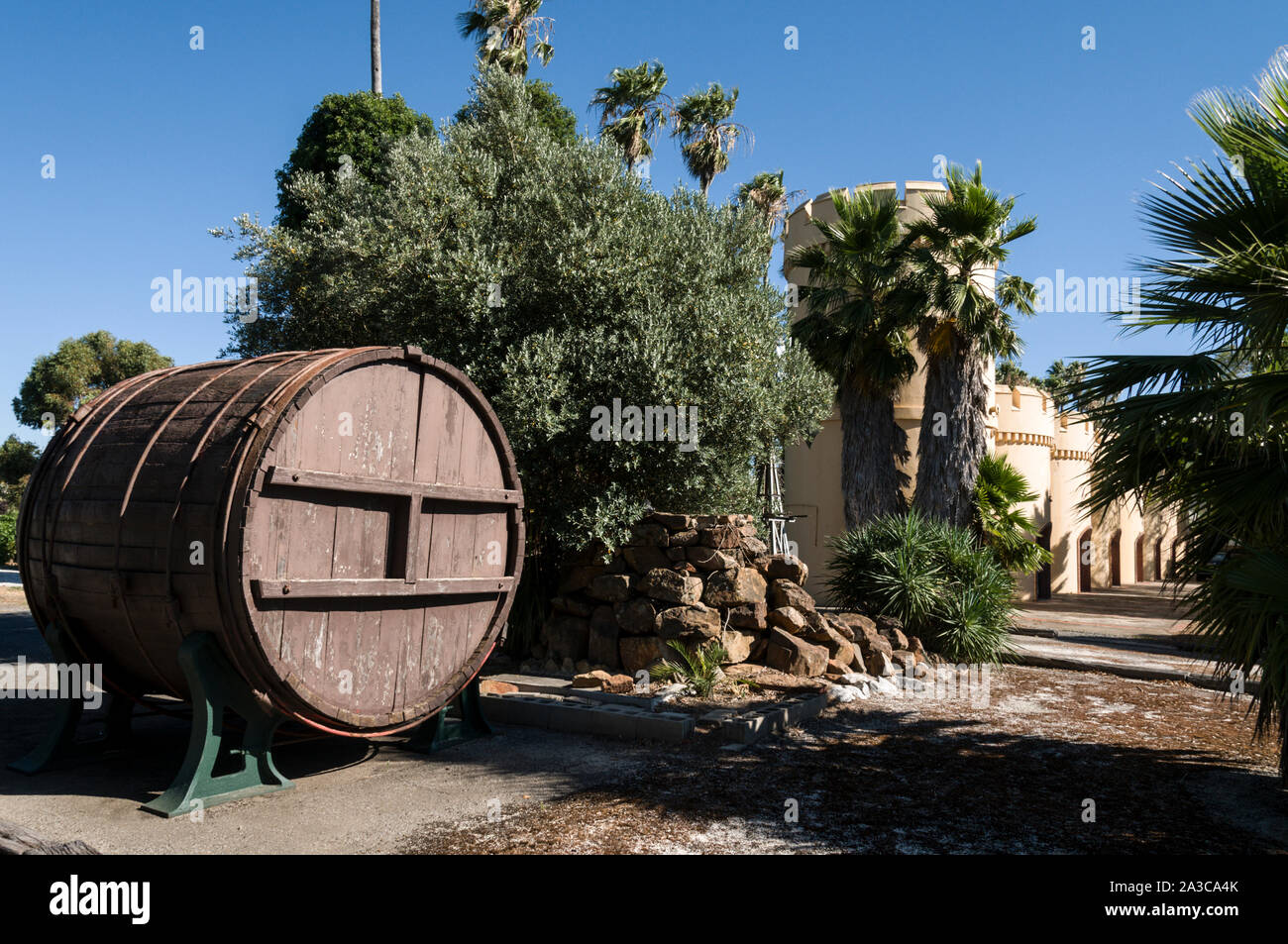 Main entrance with a giant wooden wine barrel at Chateau Dorrien winery ...