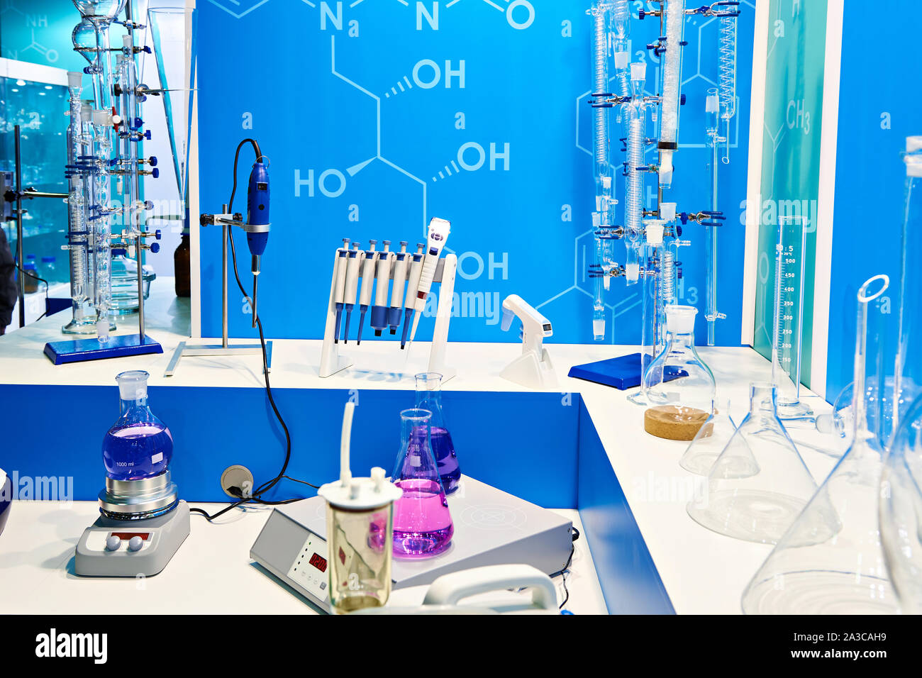 Chemical flasks with liquids and equipment in lab Stock Photo - Alamy