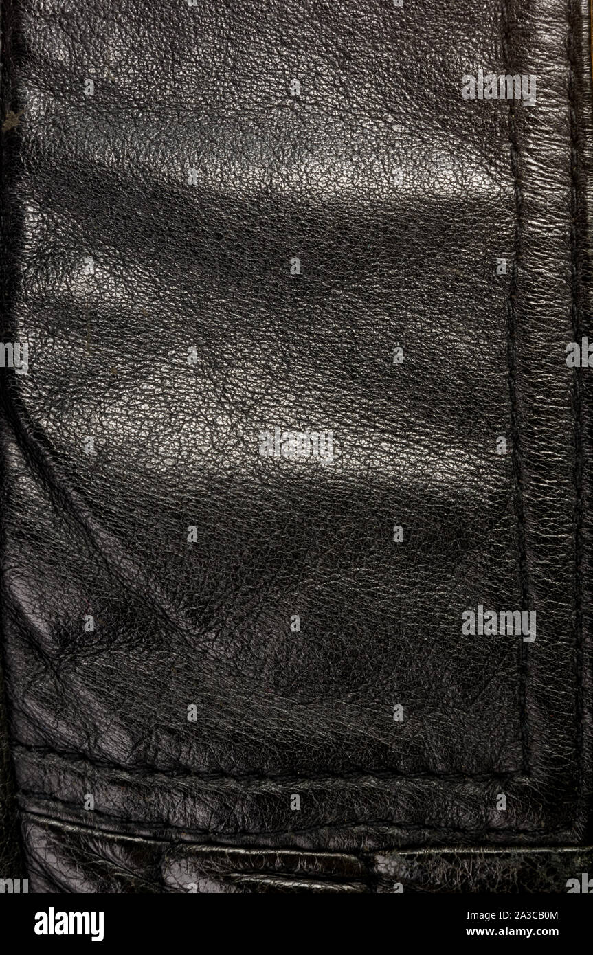Old vintage genuine soft black leather texture background, top layer ...