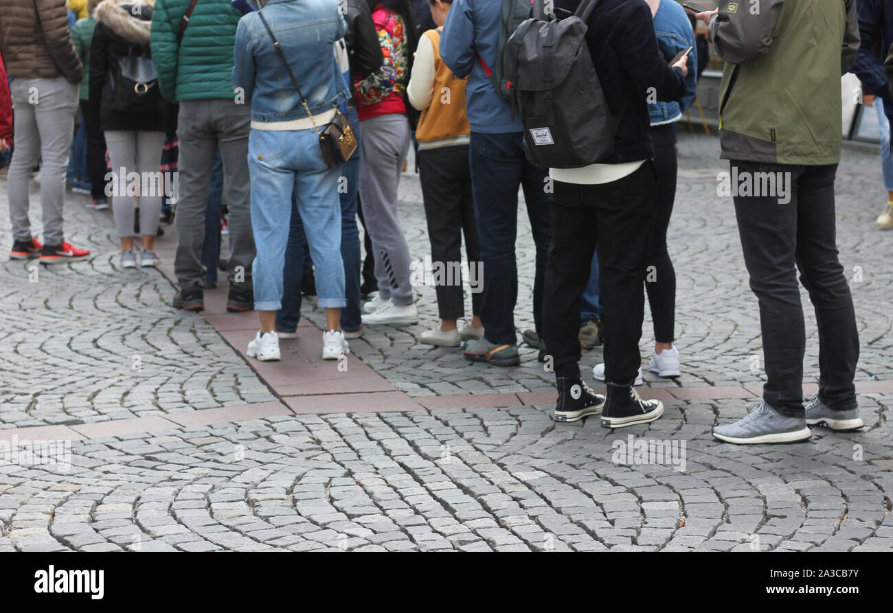 People lining up. Waiting for entrance permission to a viewing platform ...