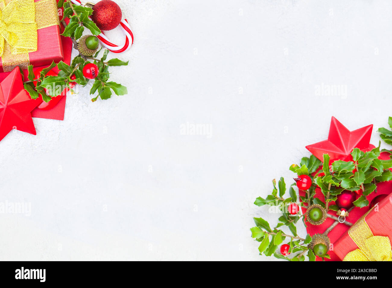 Christmas background with holly berries and decorations corner Stock ...