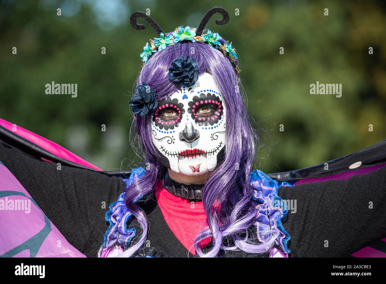 Berlin, Germany. 07th Oct, 2019. An activist of the climate movement ...