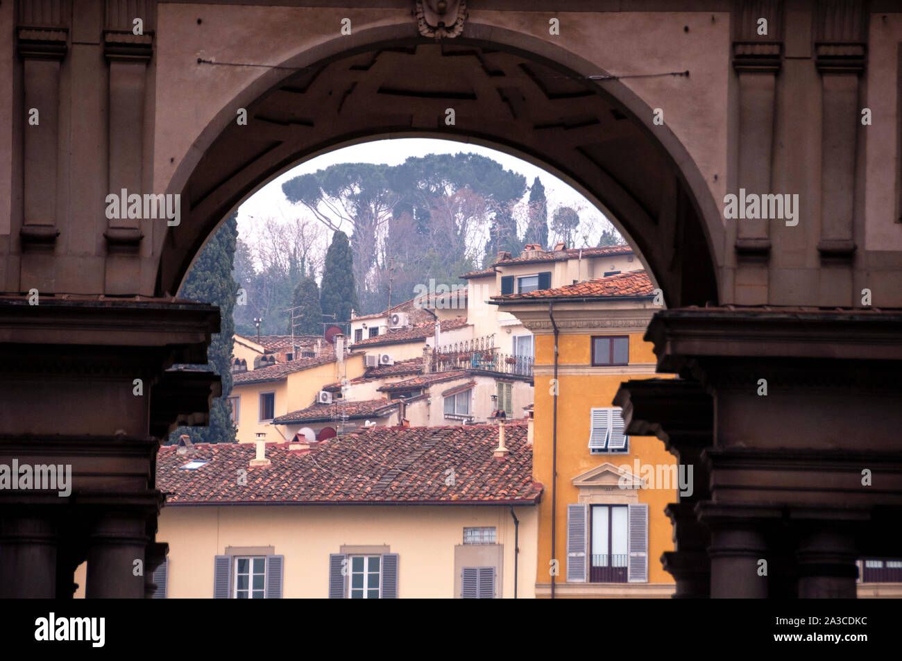 Florentine arch captures a perfectly framed still of Italian umbrella ...