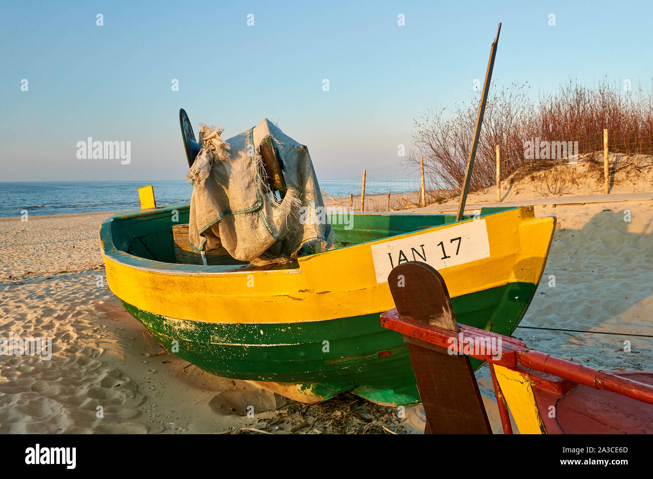 Traditional Polish fishing boats (Kutry) during a sunset on a beach ...