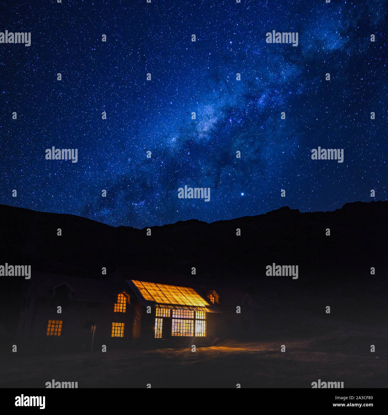 Milky Way and starry skies over a lodge in the Andes mountains. Cusco ...