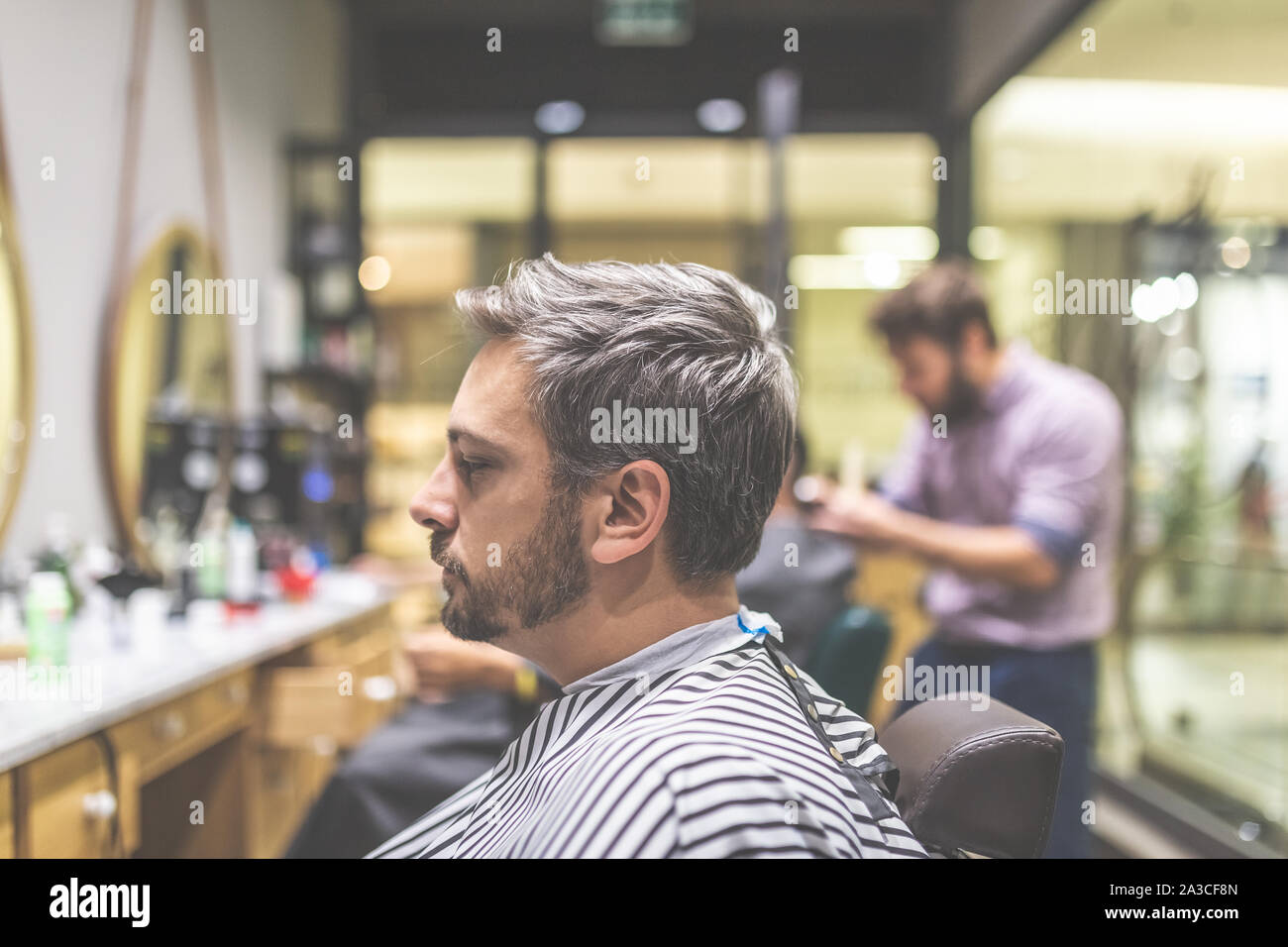 Man barbering in barber hi-res stock photography and images - Alamy
