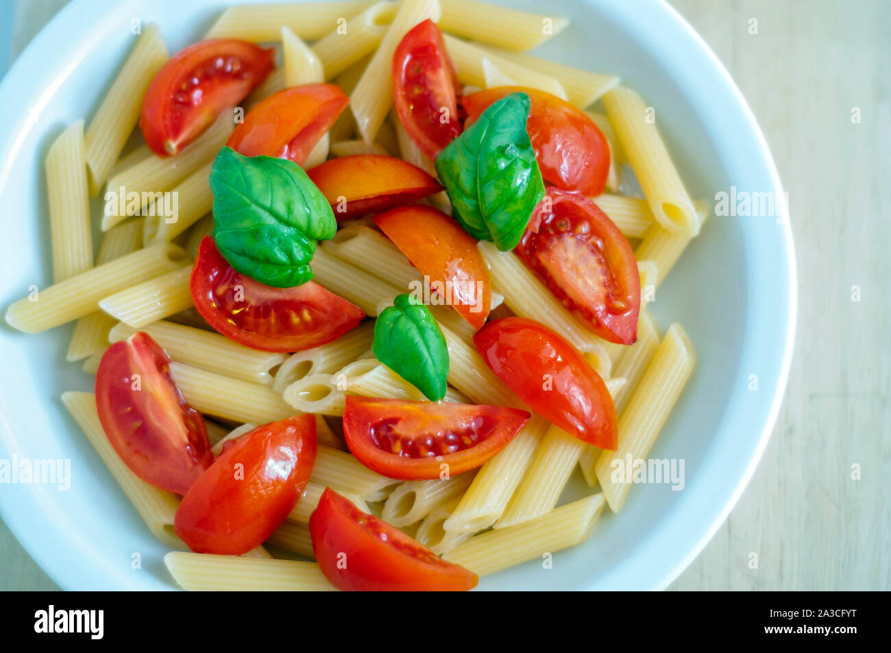 Simple Italian Pasta With Olive Oil Fresh Tomatoes And Basil Stock