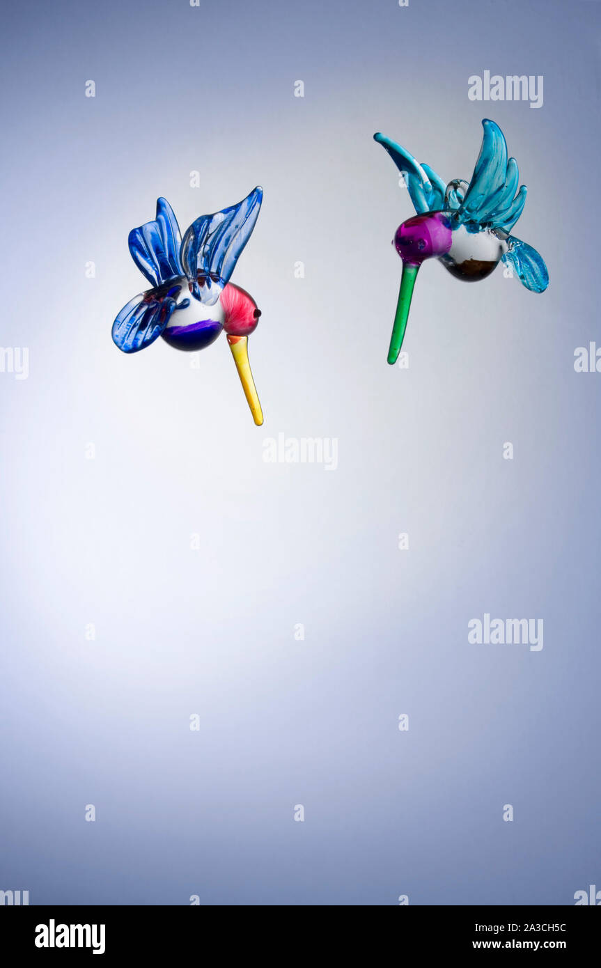 Glass Hummingbirds in Blue Stock Photo - Alamy