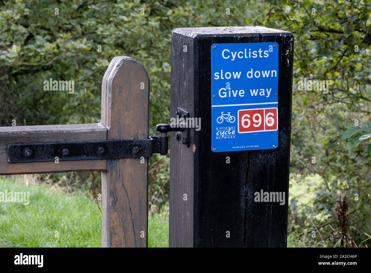 Cyclists slow down sign on the Leeds Liverpool canal at Bingley, UK ...