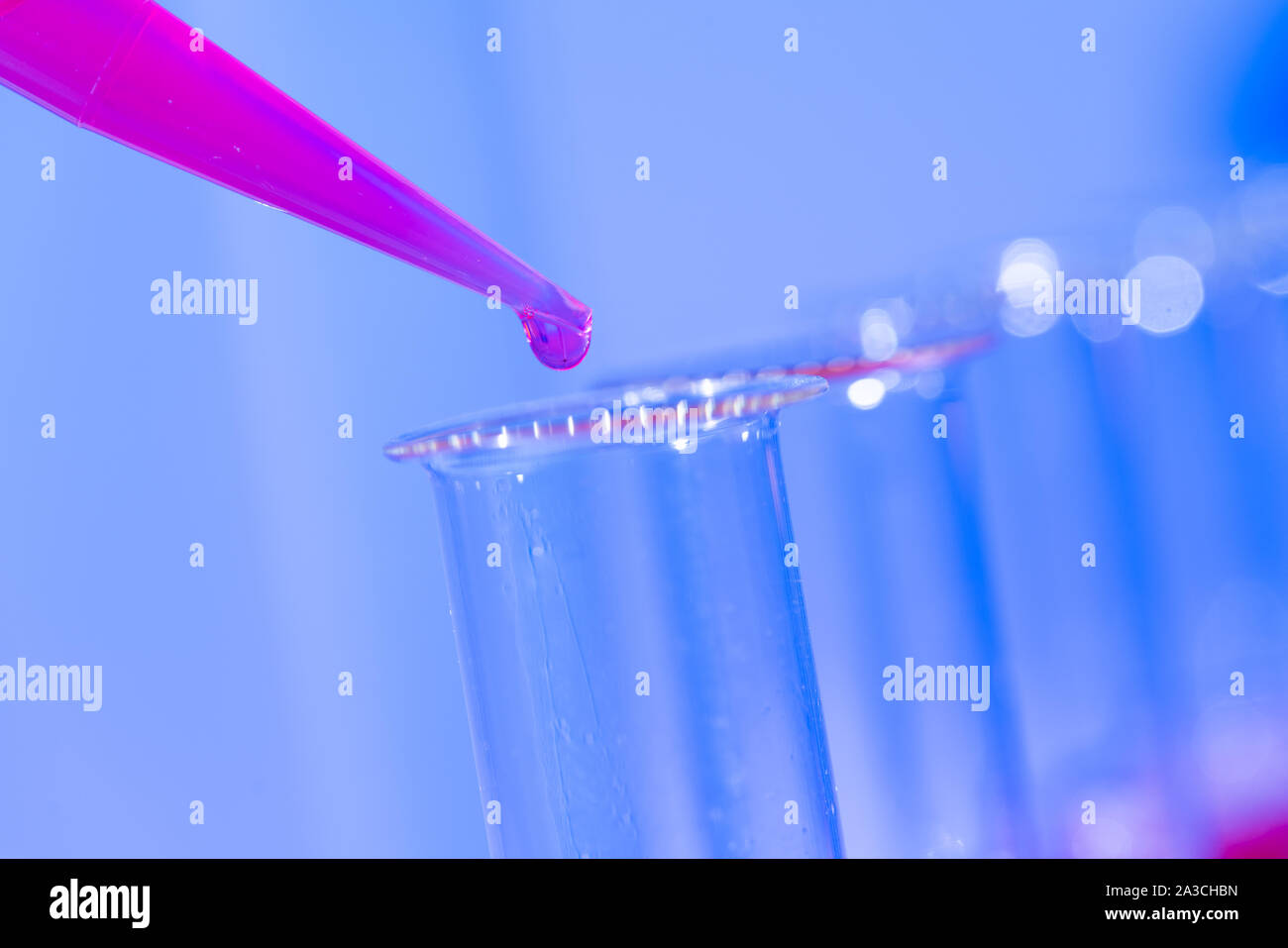 Test tube in rack and pipette media dispenser Stock Photo - Alamy