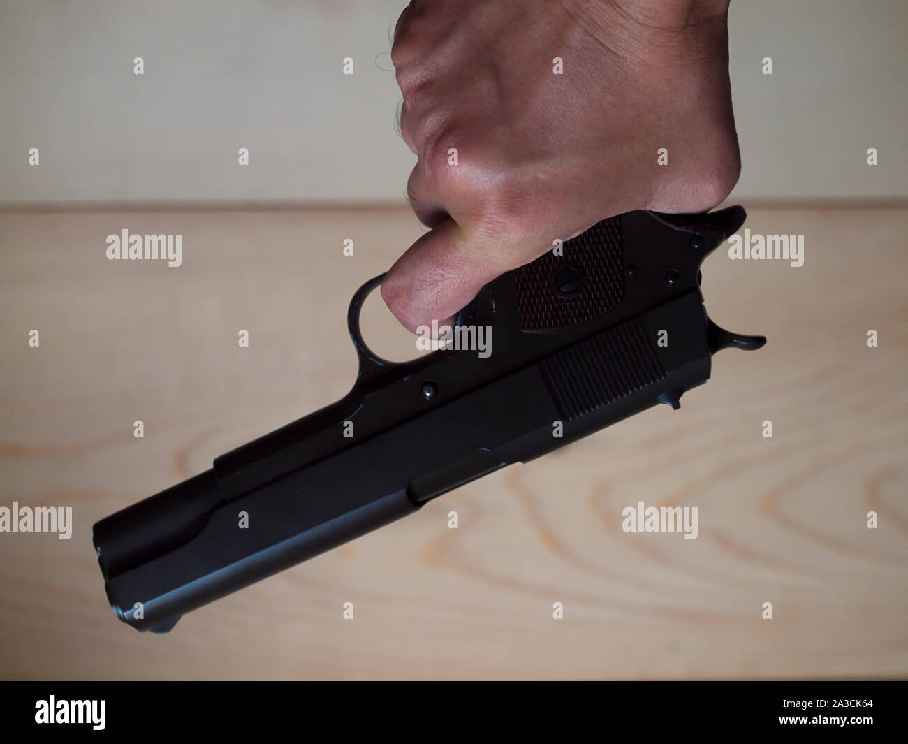 man with a gun ready to shoot (focus on the weapon Stock Photo - Alamy