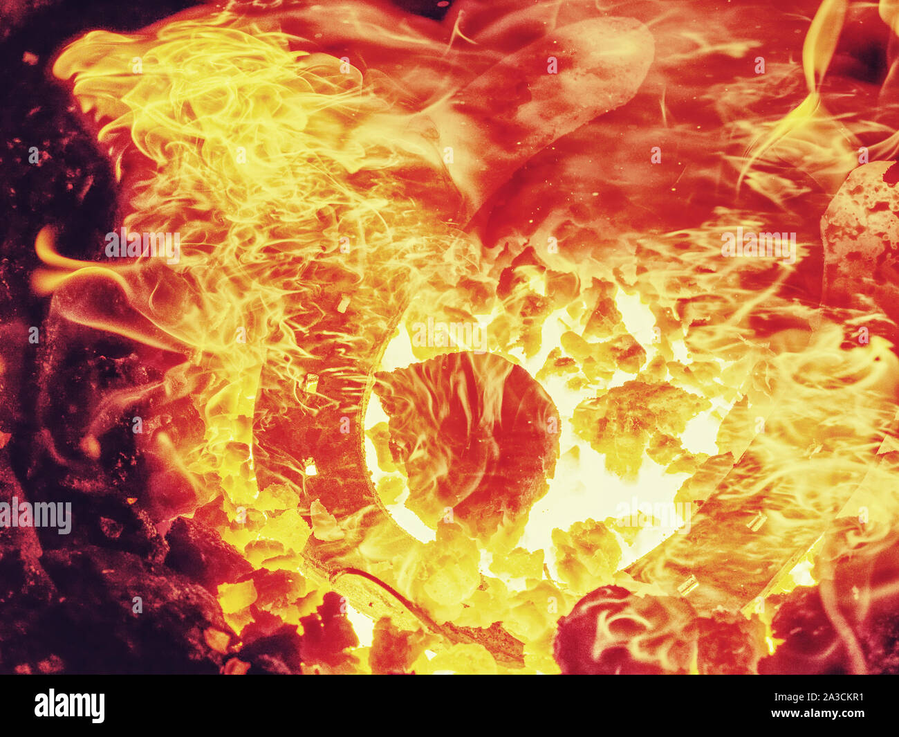 Traditional blacksmithing. Classic heating of the metal horseshoes on ...