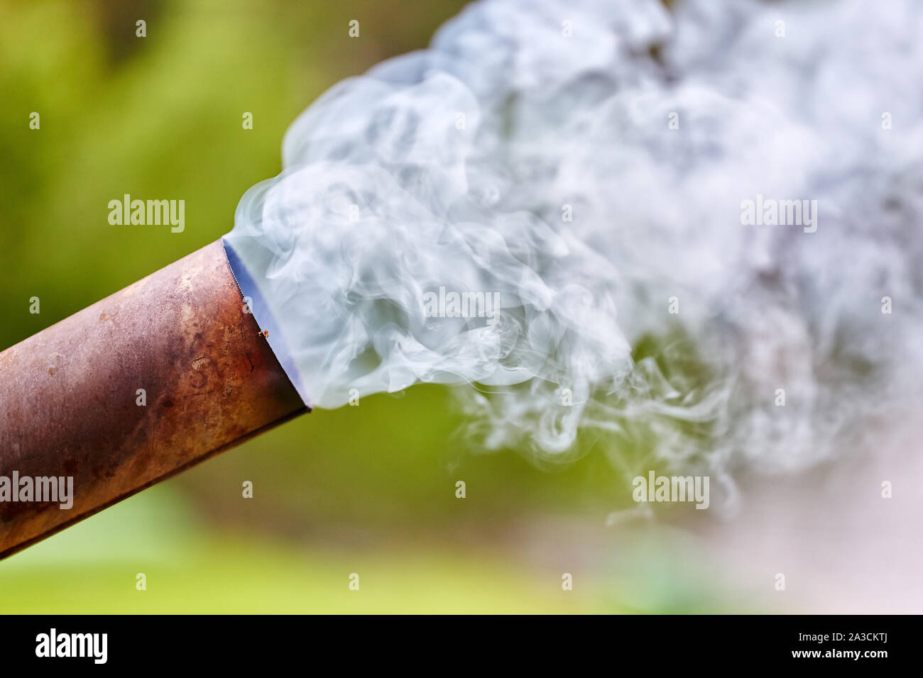 White smoke from the pipe stoves when cooking on the grill Stock Photo ...