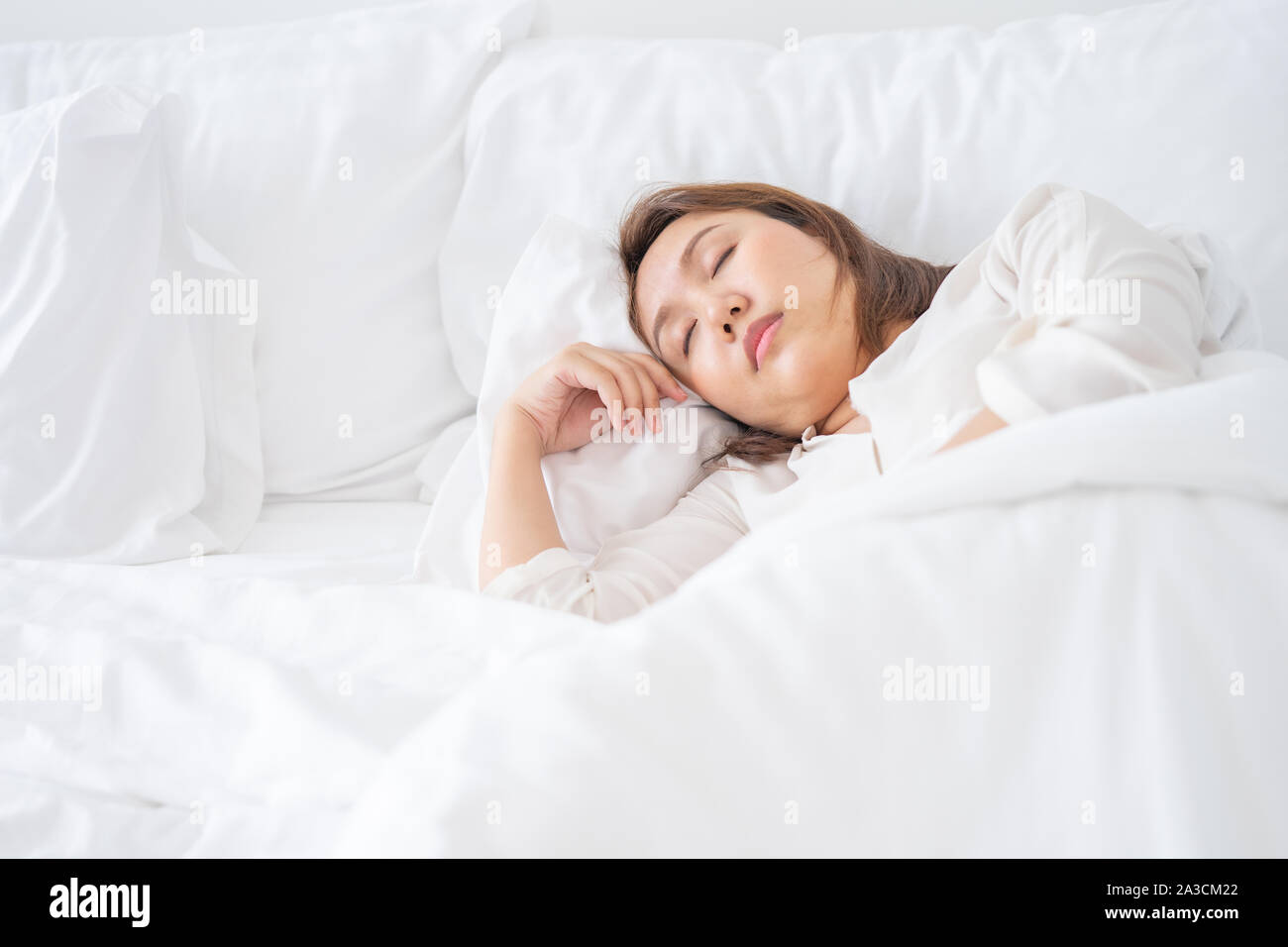 Asian beauty Sleeping deep in the bed in the bedroom To relax Hygienic ...