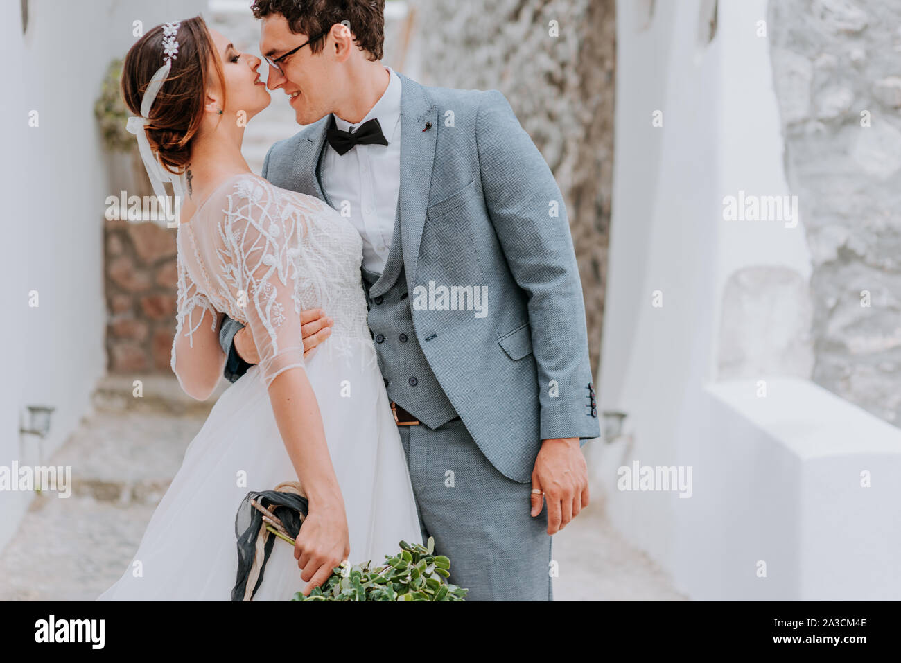 beautiful bride and groom in their summer wedding day on greek island ...