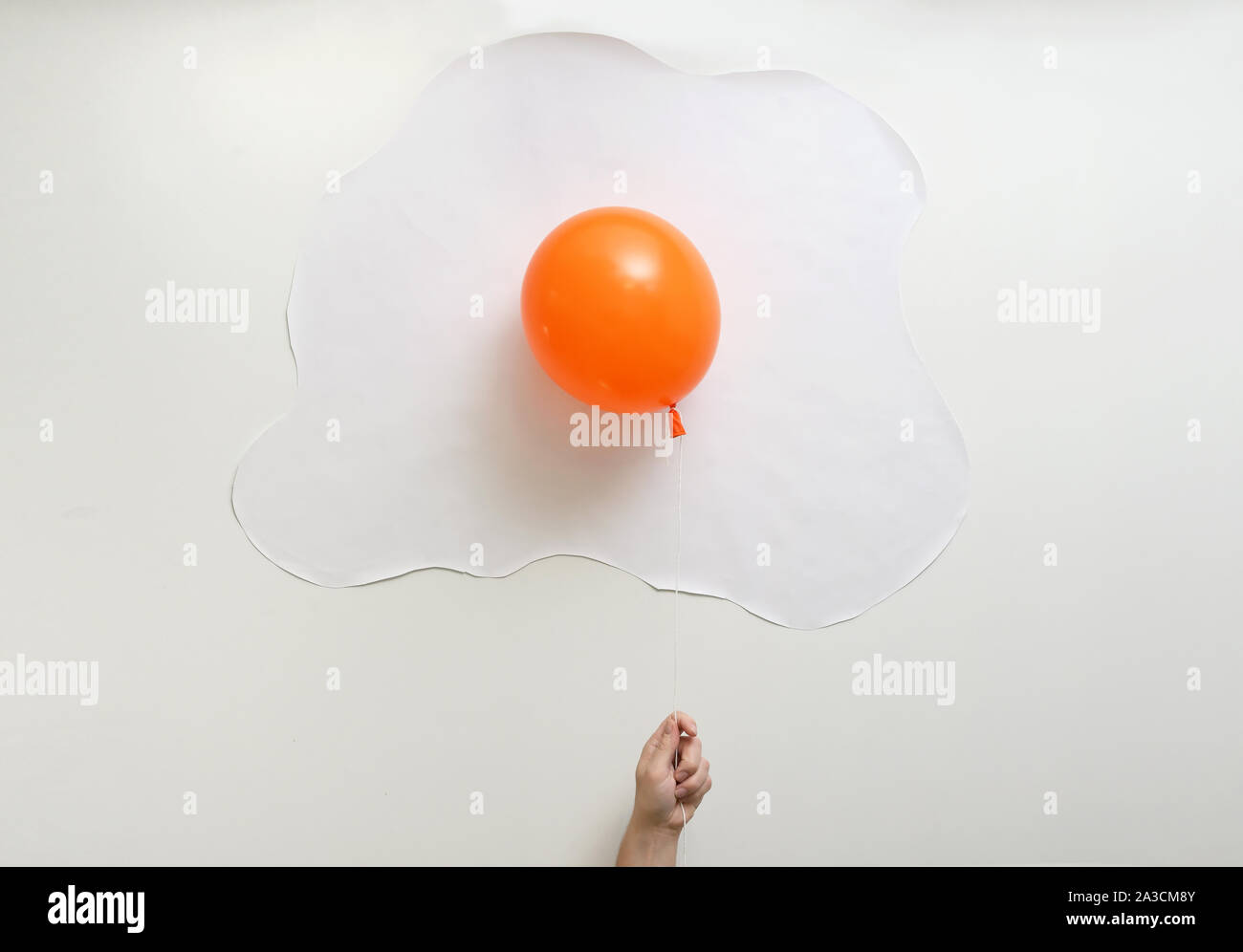 Abstract Orange Balloon With White Paper In Shape Of An Fried Egg Stock ...