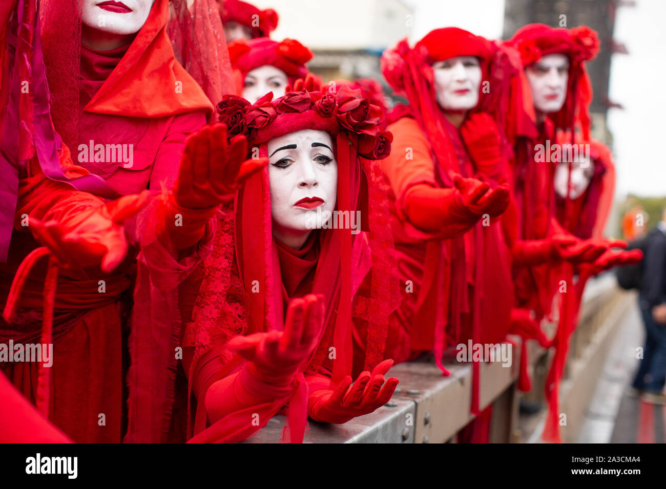 London, UK. 07th Oct, 2019. Protesters dressed in red attires perform ...