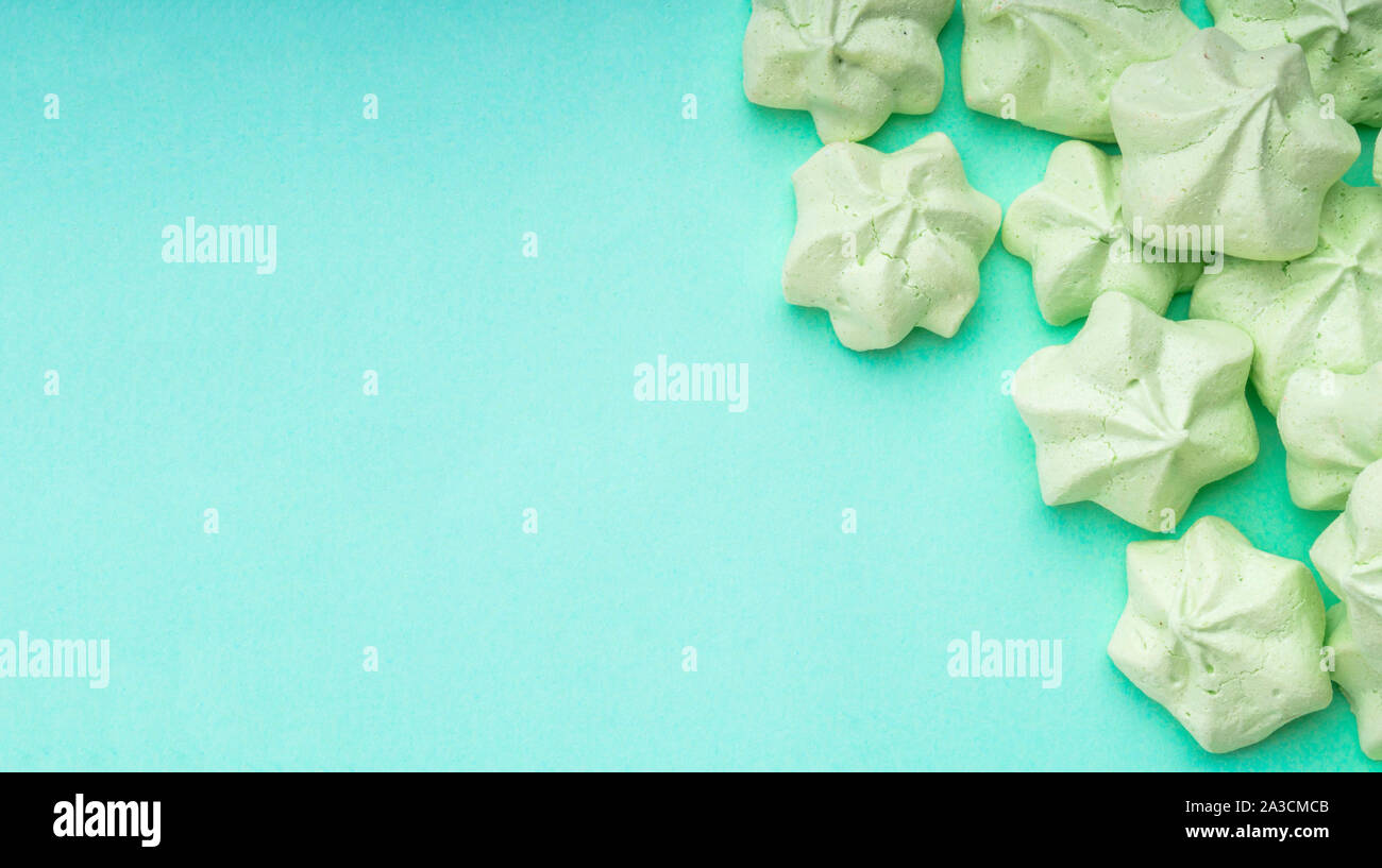 mint green sweet meringues over pastel mint backdrop with copy space ...