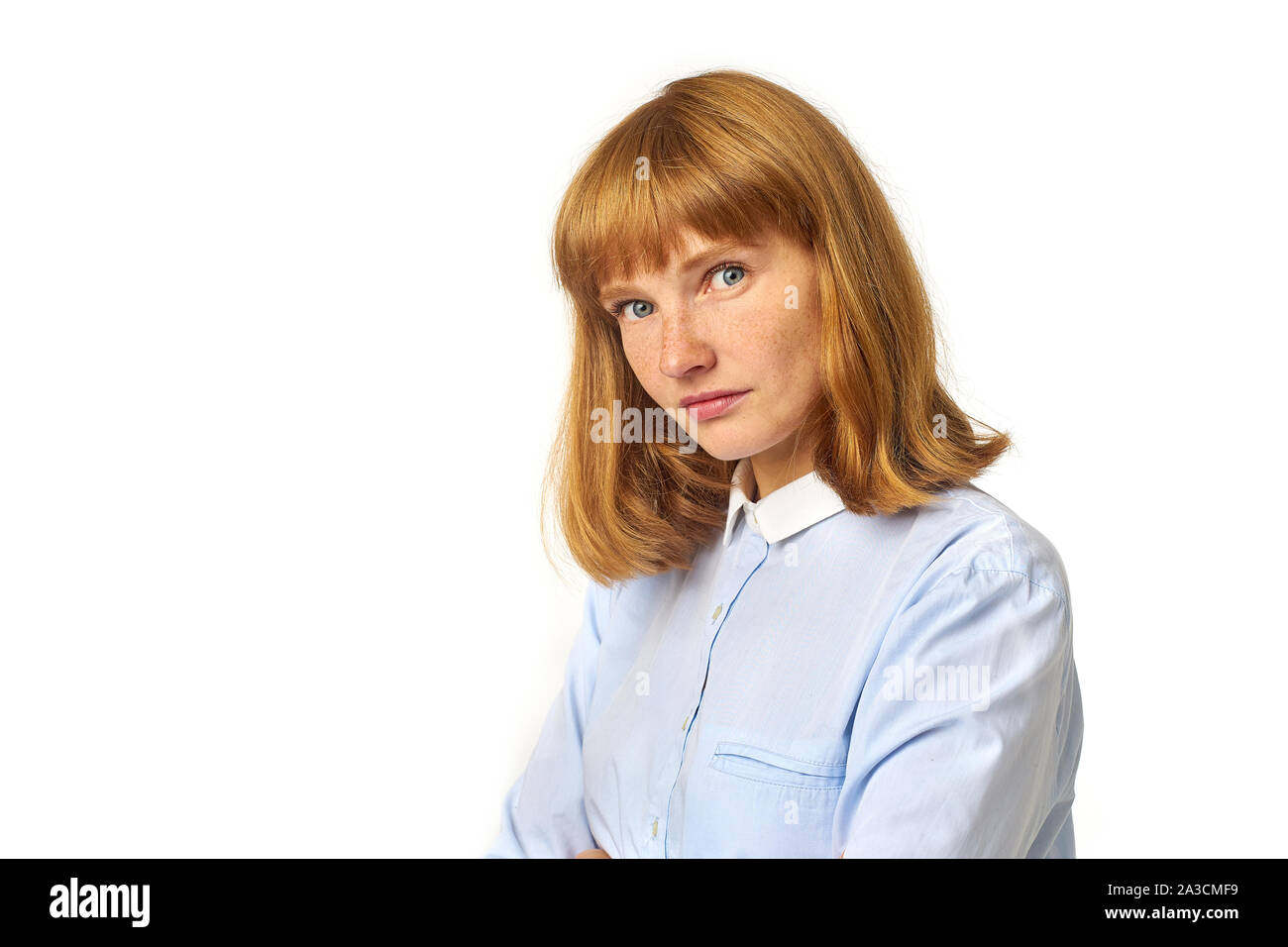 Headshot of young female model with ginger hair and freckles dressed in ...