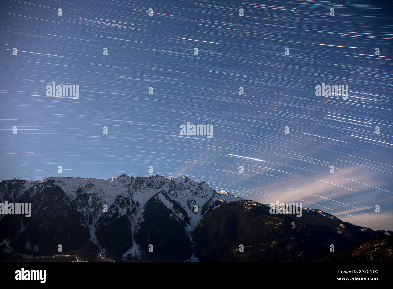 Star trails are seen above a snow covered Mount Currie in Pemberton ...