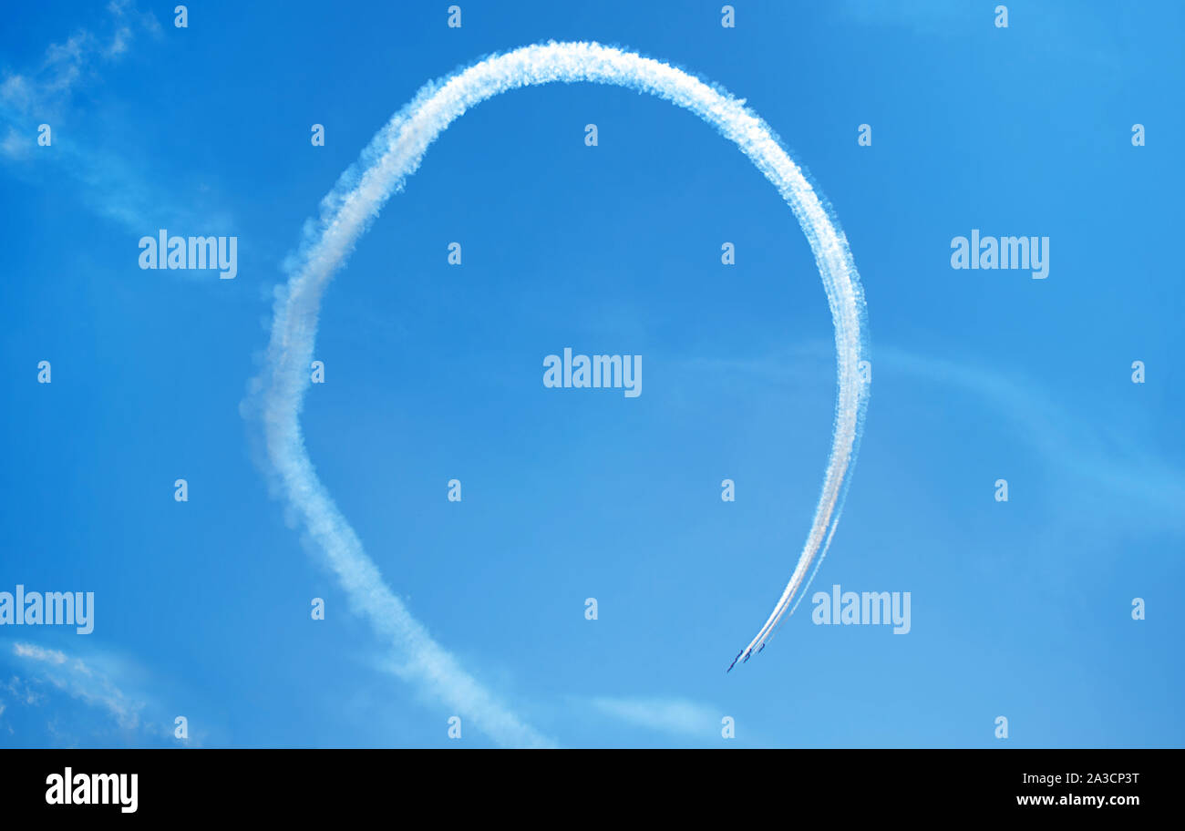 Fighter planes performing a perfect loop in formation very close to ...