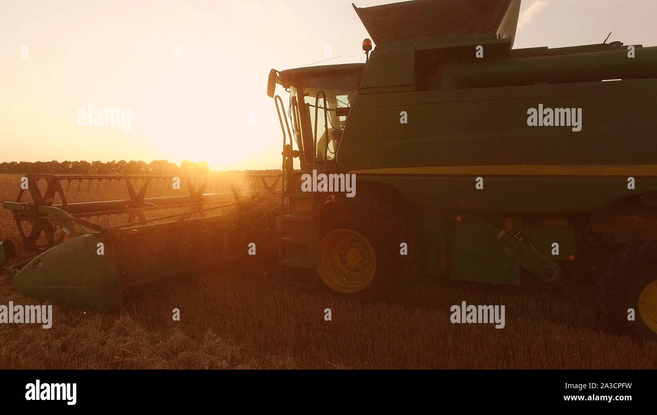 Combine field and sky. Improved farming methods Stock Photo - Alamy