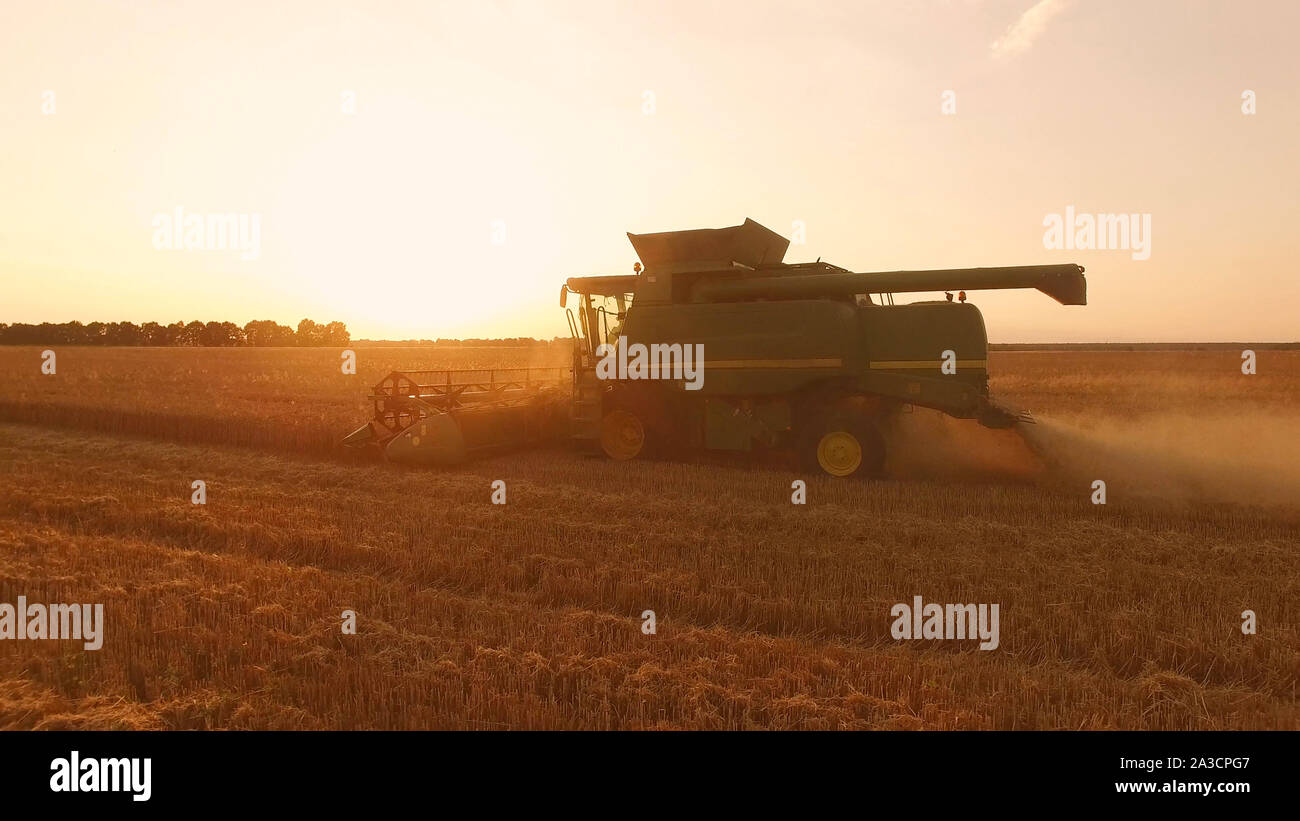 Side view of combine harvester. New farm machinery in action Stock ...